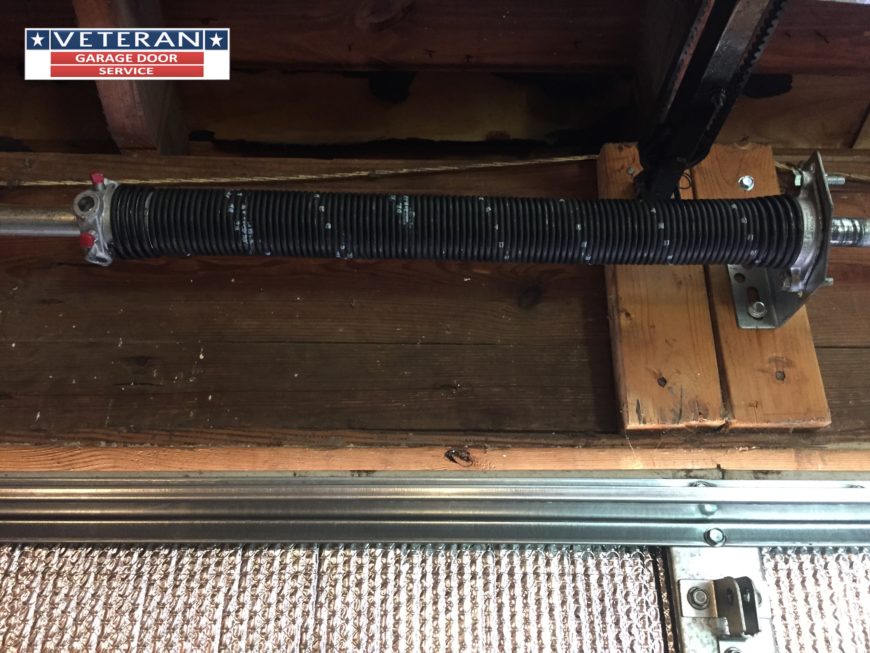 What size spring should I use for my 7’ garage door that weighs 185 pounds?